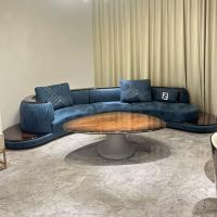 China Curved Sofa Set Multi Person Solid Wood Fabric Sponge Filled Coffee Table for sale