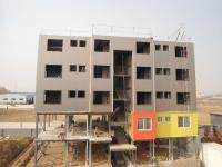 China Q355 Q235 Steel Structure Commercial Building Prefab Business Building 45m Clear Span for sale