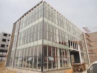 China Durable Prefabricated Steel Frame Commercial Building Q235 Q355B 50 Year Design Life for sale