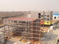 China Durable Prefabricated Steel Frame Commercial Building Q235 Q355B 50 Year Design Life for sale