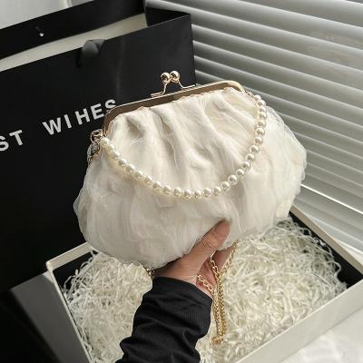 China 2024 Retro Fairy Solid Color Small Crossbody Bag White Pearl Handbag Women Net Yarn Simple Chain Bag for sale