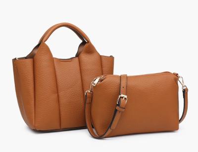 China Functional backpack Bag made of vegan leather with secure top zip closure inside zip pocket two slip pockets and long adjustable strap for everyday for sale