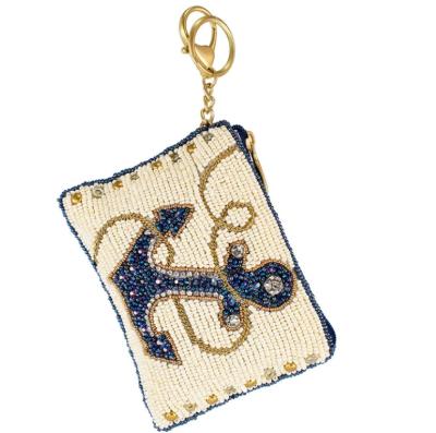 China Hooked Up Coin Purse Eye catching butterfly coin bag with bold beadwork floral patterns playful tassel key ring and zipper closure perfect for small essentials for sale