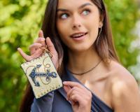 China Hooked Up Coin Purse Eye catching butterfly coin bag with bold beadwork floral patterns playful tassel key ring and zipper closure perfect for small essentials for sale