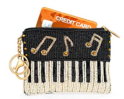 China Play it Again Coin Purse Eye catching butterfly coin bag with bold beadwork floral patterns playful tassel key ring and zipper closure perfect for small essentials for sale