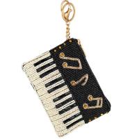 China Play it Again Coin Purse Eye catching butterfly coin bag with bold beadwork floral patterns playful tassel key ring and zipper closure perfect for small essentials for sale