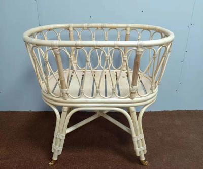 China Eco Friendly Natural Rattan Baby Bed Crib with Adjustable Mattress Height for Safety for sale