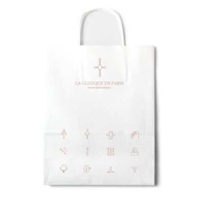 China Custom White Kraft Paper Bag with Paper Rope Handle Eco‑Friendly Hot Stamping Gift Bag, Superior Print Compatibility for Hotel, Spa & Creative Industries for sale