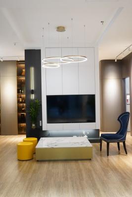 China Modern Customized White TV Cabinet with Storage Drawers, LED Lighting and 45° Splicing Technology for sale