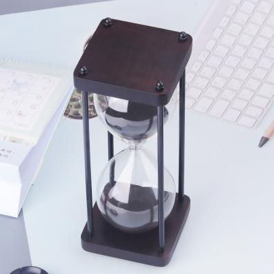 China Black Decorative Sand Hourglass Stool Wood Antique Hourglass Timer Free Sample for sale