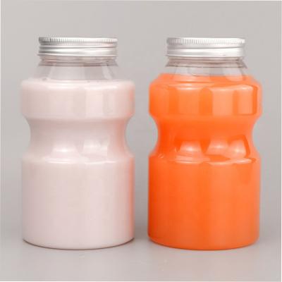 China 500ml Plastic PET Bottles Unique Shape Fruit Juice Bottles OEM With Lid for sale