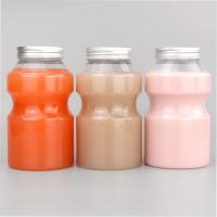 China 500ml Plastic PET Bottles Unique Shape Fruit Juice Bottles OEM With Lid for sale