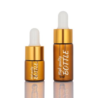 China Frosted 5ml 10ml Empty Cosmetic Bottle Amber Dropper Round Face Serum Bottle for sale