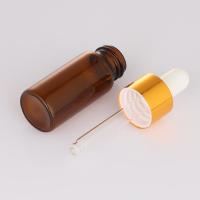 China Frosted 5ml 10ml Empty Cosmetic Bottle Amber Dropper Round Face Serum Bottle for sale