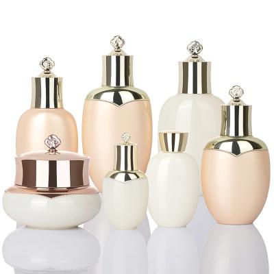 China Luxury Gold Unique 50ml Face Cream Jar 100ml 120ml 150ml Toner Lotion Bottle Skincare Suit Packaging for sale