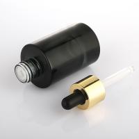 China Custom Cosmetic Serum Bottle Black Gold Frosted Flat Shoulder Dropper Bottle for sale