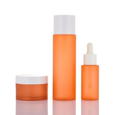 China Customzed private label orange cosmetics set screw cap dropper bottle empty jar for sale