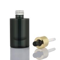 China Custom Cosmetic Serum Bottle Black Gold Frosted Flat Shoulder Dropper Bottle for sale