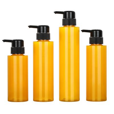 China Customized PET Round Lotion Pump Shampoo Bottle Cylinder Yellow color for sale