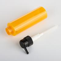 China Customized PET Round Lotion Pump Shampoo Bottle Cylinder Yellow color for sale