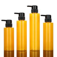 China Customized PET Round Lotion Pump Shampoo Bottle Cylinder Yellow color for sale