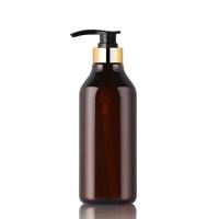 China Luxury amber 200ml 300ml 400ml 1000ml Boston body lotion cosmetic unique shampoo bottle gold top for sale