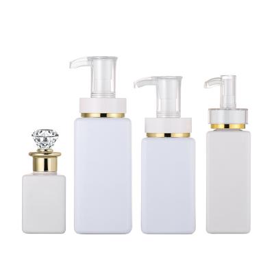 China High Quality Luxury White Customize Square  Shampoo Hair Lotion Bottle With Diamond Gold Rim Cap for sale