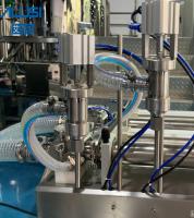China Semi Automatic Double Heads Paste Piston Filler Water Bottle Pneumatic Filling Machine for sale