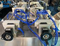 China Semi Automatic Double Heads Paste Piston Filler Water Bottle Pneumatic Filling Machine for sale