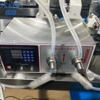 China Double Head Magnetic Pump Liquid Filling Machine Liquor Beverage Edible Oil for sale
