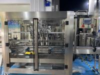 China Automatic 2-8 Nozzle Liquid Filling Machine 100-1000ml Stainless Steel Bottle Filler for sale