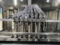 China Automatic 2-8 Nozzle Liquid Filling Machine 100-1000ml Stainless Steel Bottle Filler for sale
