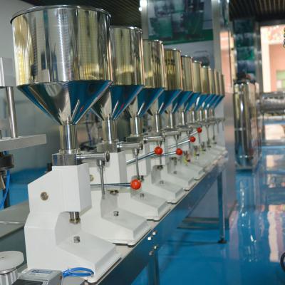 China Manual Paste Filling Machine 5-50ml for Shampoo Cream Lotion Honey Stainless Steel Piston Filler for sale