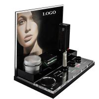 China Clear Makeup Display Case Black Stand Rack Counter Acrylic Cosmetics Display Rack for sale