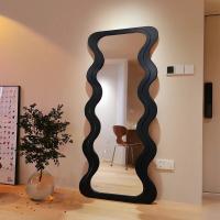 China OEM Floor Wavy Standing Mirror Black Ornate Wooden Frame for sale