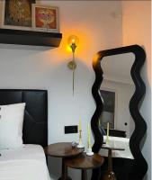 China OEM Floor Wavy Standing Mirror Black Ornate Wooden Frame for sale