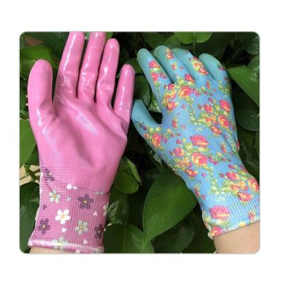 China 13 Gauge Colorful Flower Knitting Protective Agriculture Nitrile Gloves for sale