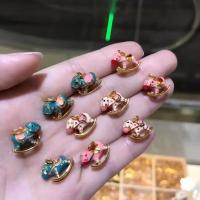 China 18K Gold Pendant Painted Rocking Horse 0.38g 14.6mm Cute Light Luxury Jewelry for sale