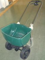 China Four Wheel Manual Salt Fertilizer Spreader Tow Behind Grass Seed Spreader for sale