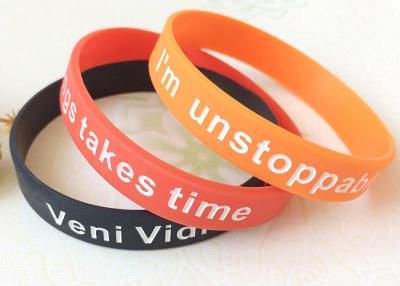 China Adult Logo Depressed And Dyed Custmozied Promotional Silicone Rubber Wristbands for sale