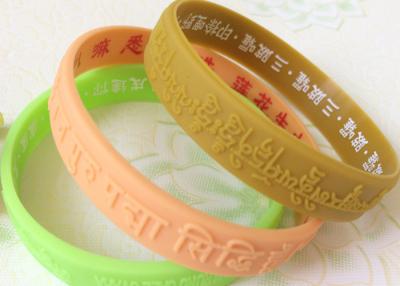 China Logo Text Embossed Custmozied Advertising Man Silicone Rubber Wristbands for sale