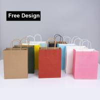 China Christmas Gift Packaging Kraft Paper Bag with Flexiloop Handle and Custom Logo Design for sale