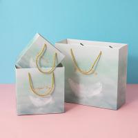 China Custom Logo Kraft Paper Gift Bag with Handles Stand Up Pouch for Jewelry Garment Packaging for sale