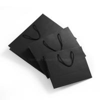 China Custom Black Matte Art Paper Shopping Bag with Luxury Design for Retail Stores for sale