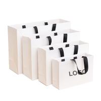 China Custom Matte Black Paper Bags with Logo for Boutique Retail 30x20x10cm for sale