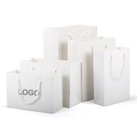 China Customized Flexiloop Handle Cardboard Shopping Packaging Paper Bag With Logo For Your for sale