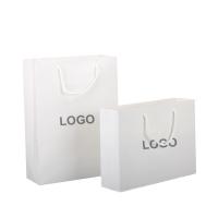 China Custom Kraft Paper Gift Bags with Ribbon Handles Customized Printing 300gsm for sale