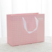China Custom Kraft Paper Gift Bag with Ribbon Rope Handle for Clothing Shop Packaging 32x24x10cm for sale