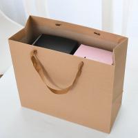 China Custom Kraft Paper Gift Bag with Ribbon Rope Handle for Clothing Shop Packaging 32x24x10cm for sale