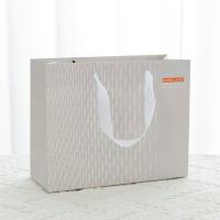 China Custom Pink 250G Kraft Paper Gift Bags with Three-Strand Rope Handles Matte Gold Logo for sale